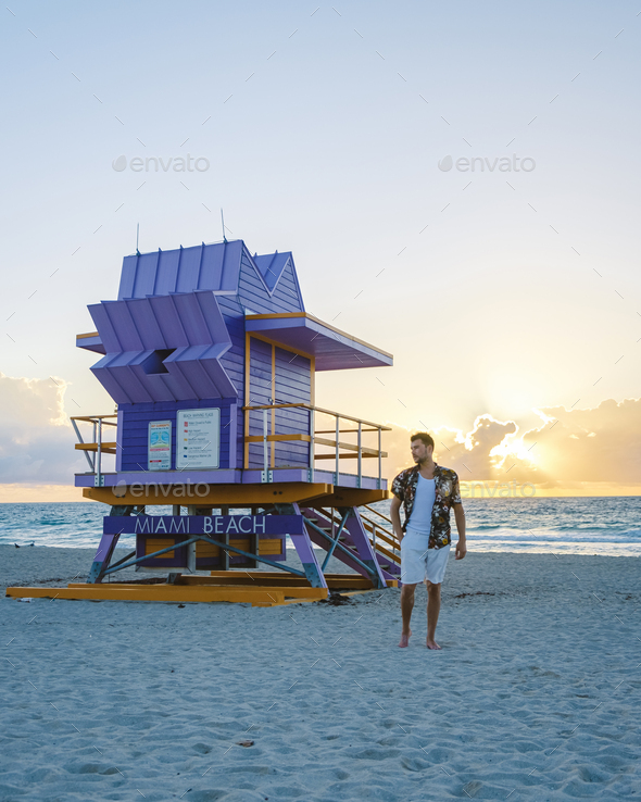 Miami beach, young men on the beach at Miami beach, lifeguard hut Miami ...