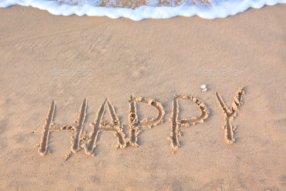 word "happy" written on beach sand Stock Photo by nzooo | PhotoDune