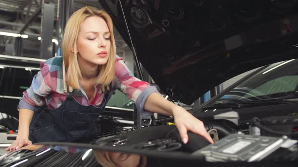 Pretty Woman Checking Liquid Coolant, Stock Footage | VideoHive