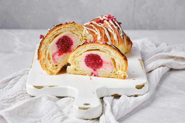 Croissant cut in half, showing the cross section with raspberry ...