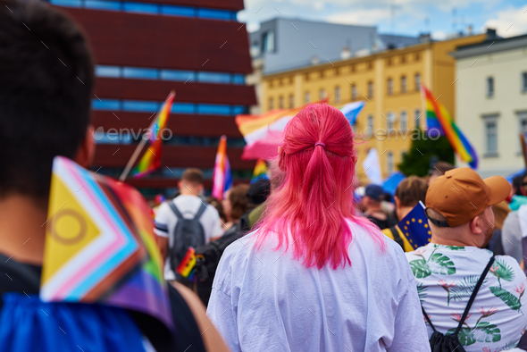 People crowd with LGBTQ rainbow flags on pride demonstration Stock ...