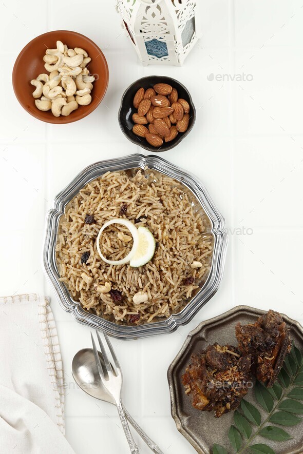 Nasi Kebuli Kambing or Arabic Kabli Rice Stock Photo by ikadapurhangus