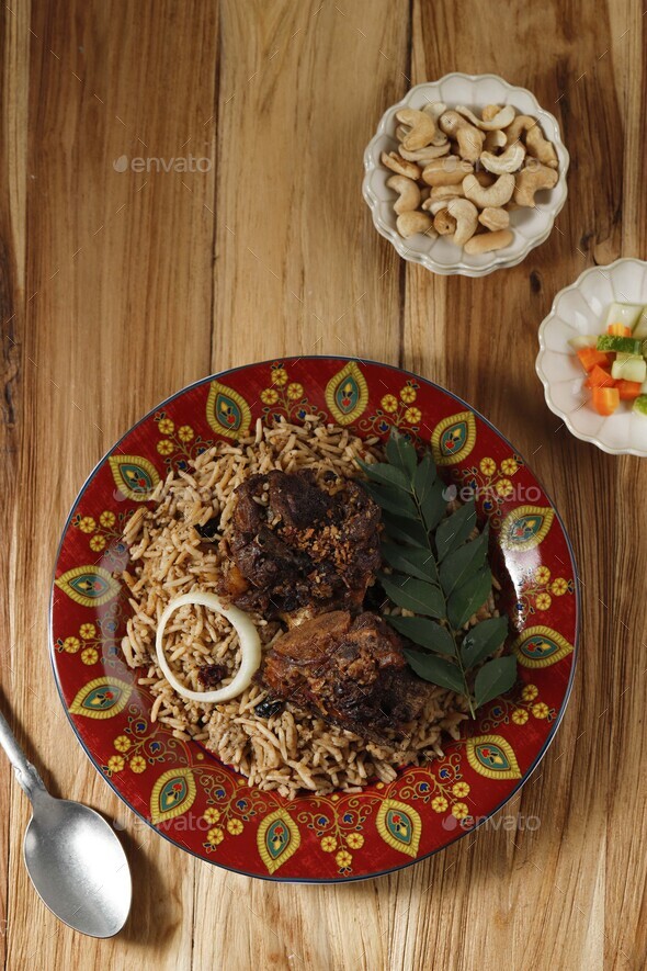 Nasi Kebuli Kambing or Arabic Kabli Rice Stock Photo by ikadapurhangus