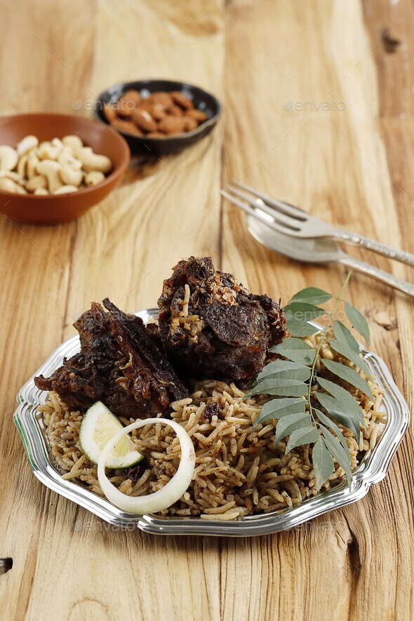 Nasi Kebuli Kambing or Arabic Kabli Rice Stock Photo by ikadapurhangus