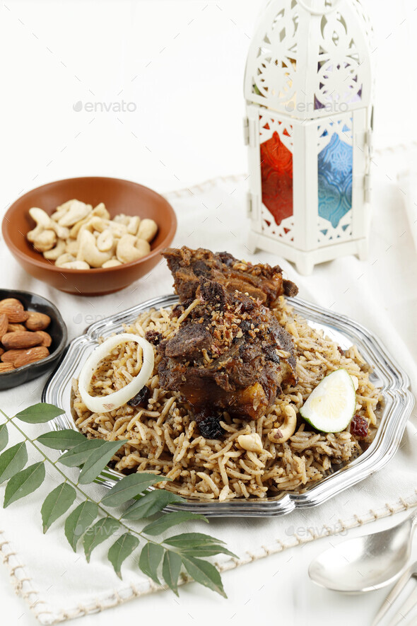 Nasi Kebuli Kambing or Arabic Kabli Rice Stock Photo by ikadapurhangus