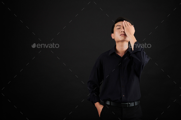 Embarrassed Man Making Face Palm Gesture Stock Photo by DragonImages