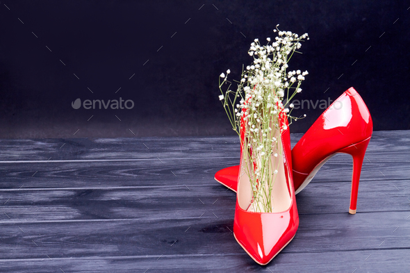 Pair of red high heel shoes with white flowers. Stock Photo by ...