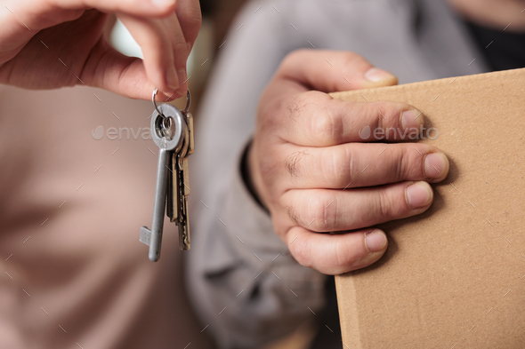 Married people holding keys of household property to move in Stock ...