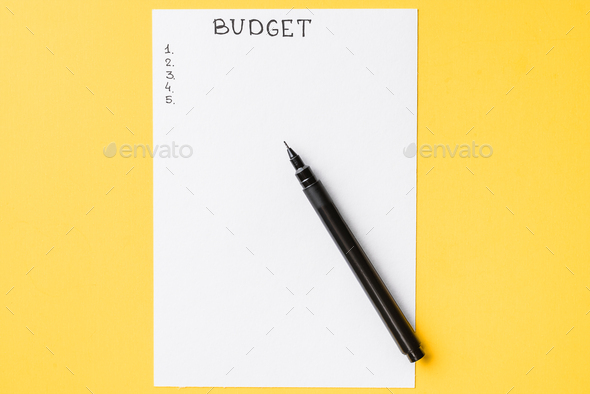 Notepad with word budget and checklist on a yellow background Stock ...