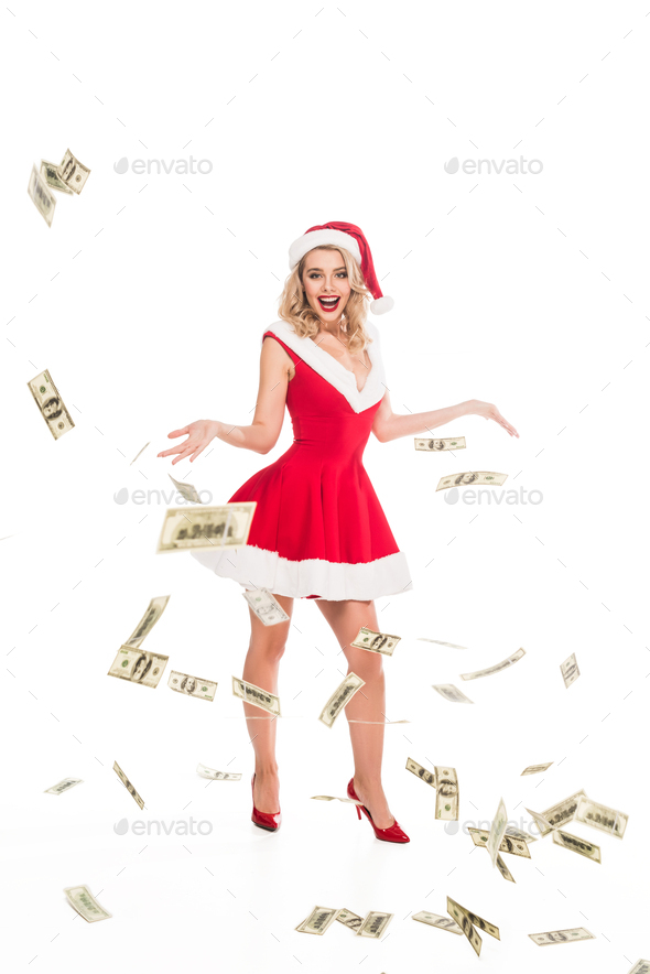 happy santa girl in christmas hat throwing out cash money isolated on ...