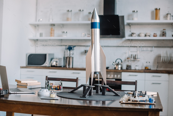 rocket model and tools for engineering on table in kitchen Stock Photo ...