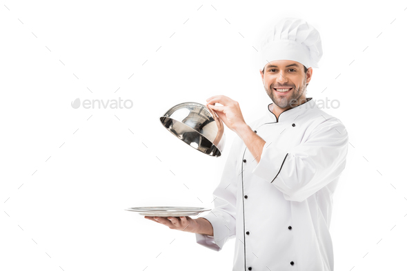 young chef taking of serving dome from plate isolated on white Stock ...
