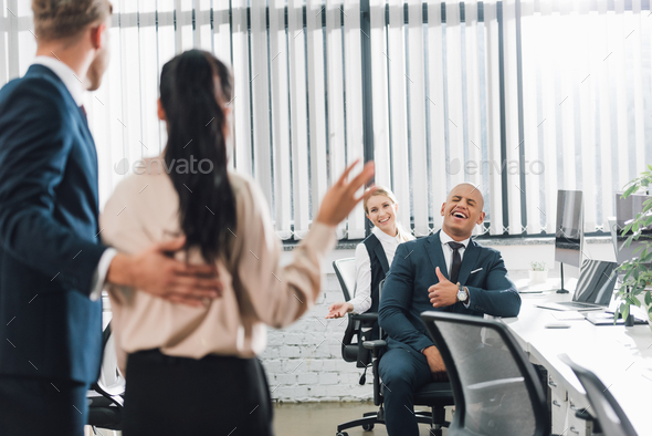 businessman introducing new colleague waving hand and greeting ...