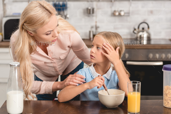 daughter complains about bad feeling to her mother during breakfast ...