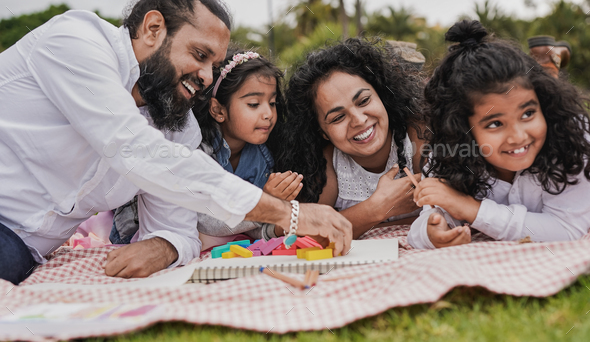 Happy indian family enjoy playful time together at city park Stock ...