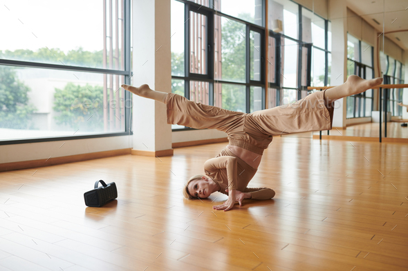 Dancer Doing upside down Splits Stock Photo by DragonImages | PhotoDune