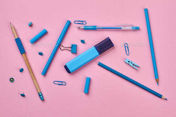 Blue school supplies on white background. Stock Photo by stockfilmstudio