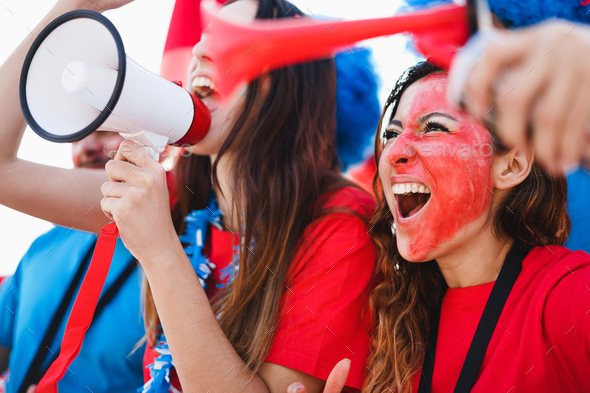 Crazy sport fans screaming while supporting their team - Focus on right ...