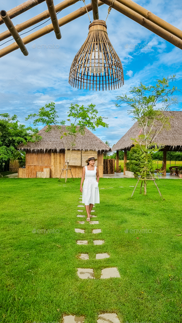 Asian women at a Eco farm homestay with a rice field in central ...