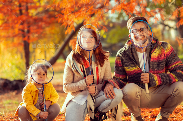 Family playing badminton Stock Photo by Impactphotography | PhotoDune