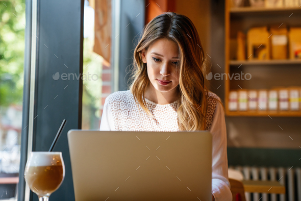 Happy successful businesswoman remote working on laptop: People ...