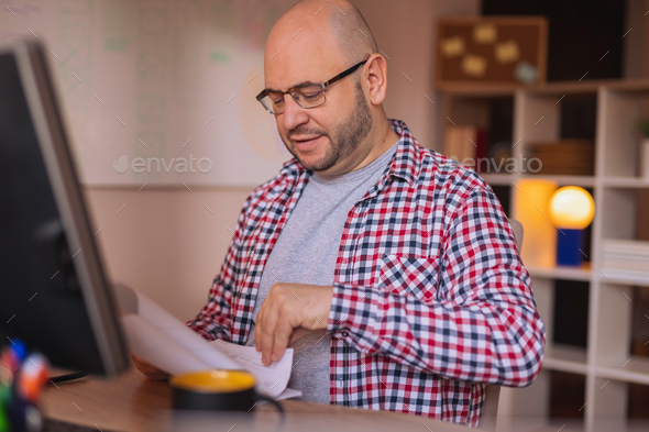 Man doing paperwork Stock Photo by Impactphotography | PhotoDune