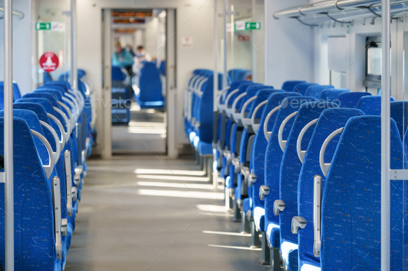 Interior of modern passenger high-speed express train, row of empty ...