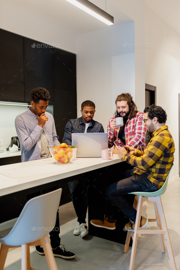 coworkers of different races in the workplace Stock Photo by Meniphoto