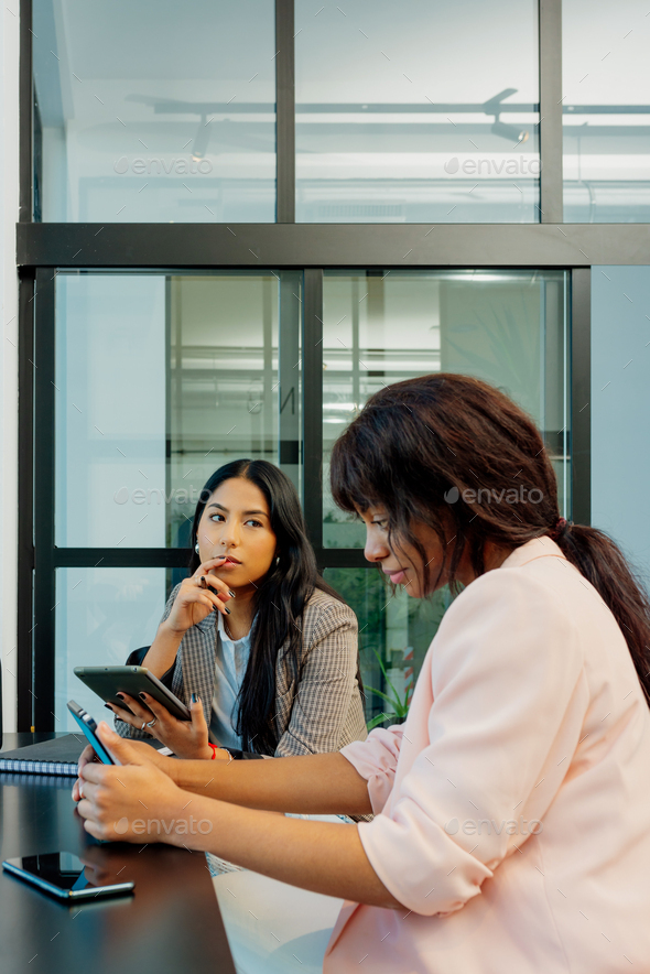 coworkers of different races in the workplace Stock Photo by Meniphoto