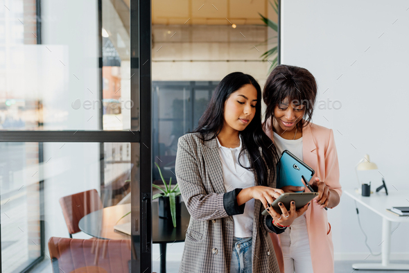 coworkers of different races in the workplace Stock Photo by Meniphoto