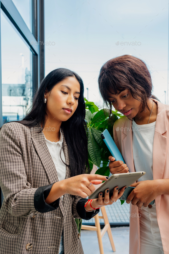 coworkers of different races in the workplace Stock Photo by Meniphoto