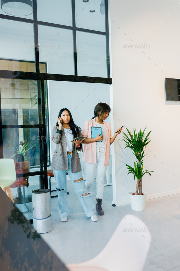 coworkers of different races in the workplace Stock Photo by Meniphoto