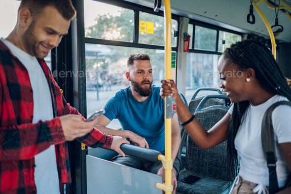 Multiracial group of friends talking while riding in a bus Stock Photo ...