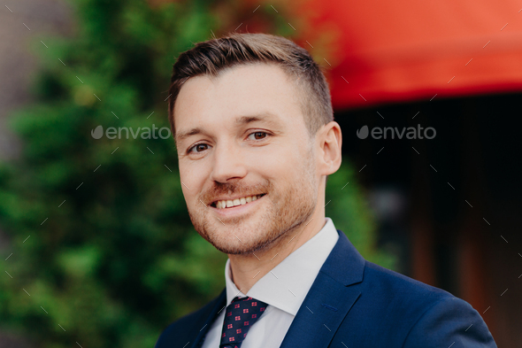 Close up portrait of handsome attractive male with gentle smile ...