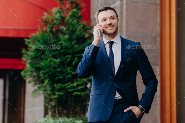 Optimistic male owner of buisness company dressed in elegant suit Stock ...
