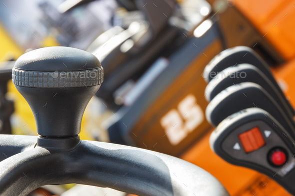 Steering wheel and operating control panels or levers with buttons in ...