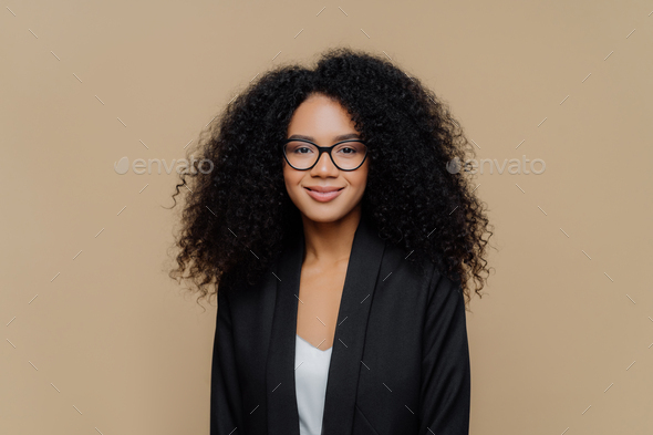 Portrait of beautiful Afro American woman with crisp hair, dressed in ...