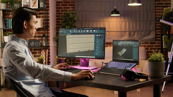 Digital technician designing industrial container and engine component ...