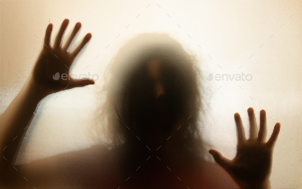 Shadowy figure behind glass - horror background Stock Photo by erika8213
