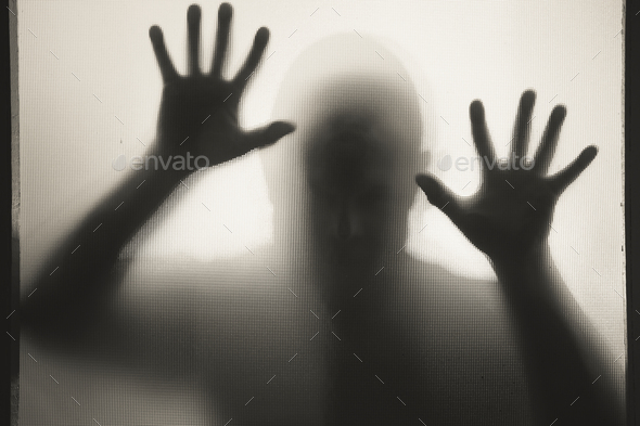 Shadowy figure behind glass - horror background Stock Photo by erika8213