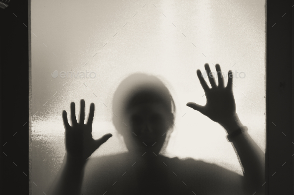 Shadowy figure behind glass - horror background Stock Photo by erika8213