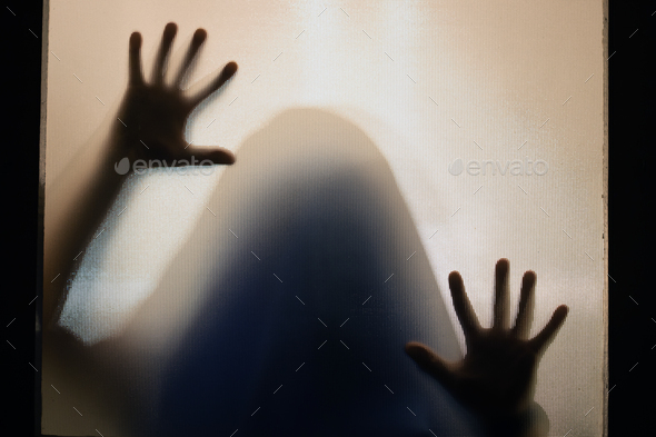 Shadowy figure behind glass - creepy, horror background Stock Photo by ...