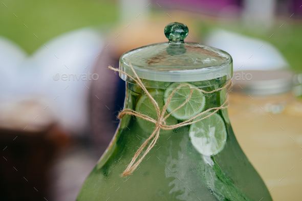 Photo of fresh lime drink in glass container. Cold lemonade. Horizontal ...