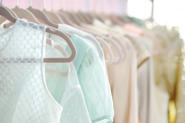 Few beautiful dresses on a hanger in wedding salon Stock Photo by Maria ...