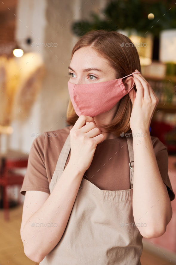 Waitress Putting On Mask Stock Photo by Media_photos | PhotoDune