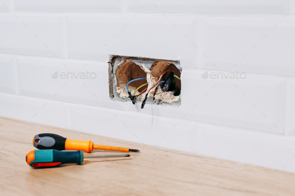 Installation of power socket Stock Photo by Lazy_Bear | PhotoDune