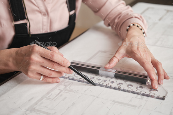 Female hands creating technical drawing Stock Photo by Media_photos