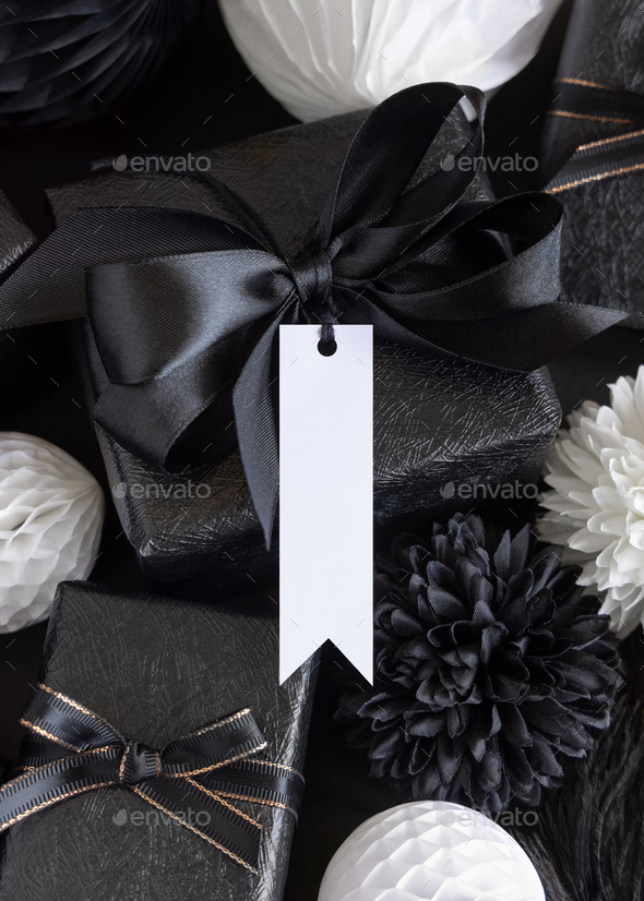 Gift Boxes with Black and white paper flowers and decorations, vertical ...