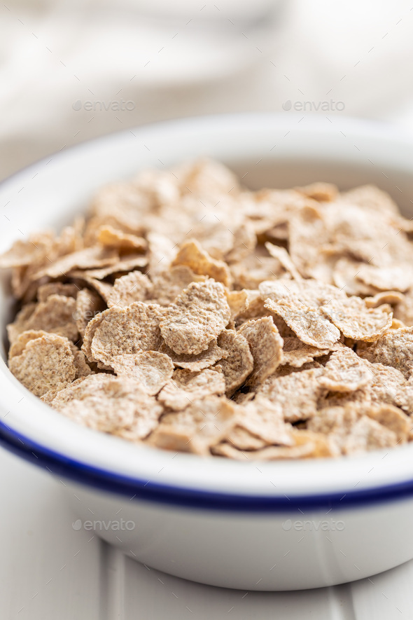Whole grain cereal flakes. Wholegrain breakfast cereals in bowl on ...
