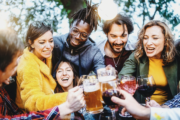 Family toasting beers outdoors in the farmyard Stock Photo by baffos